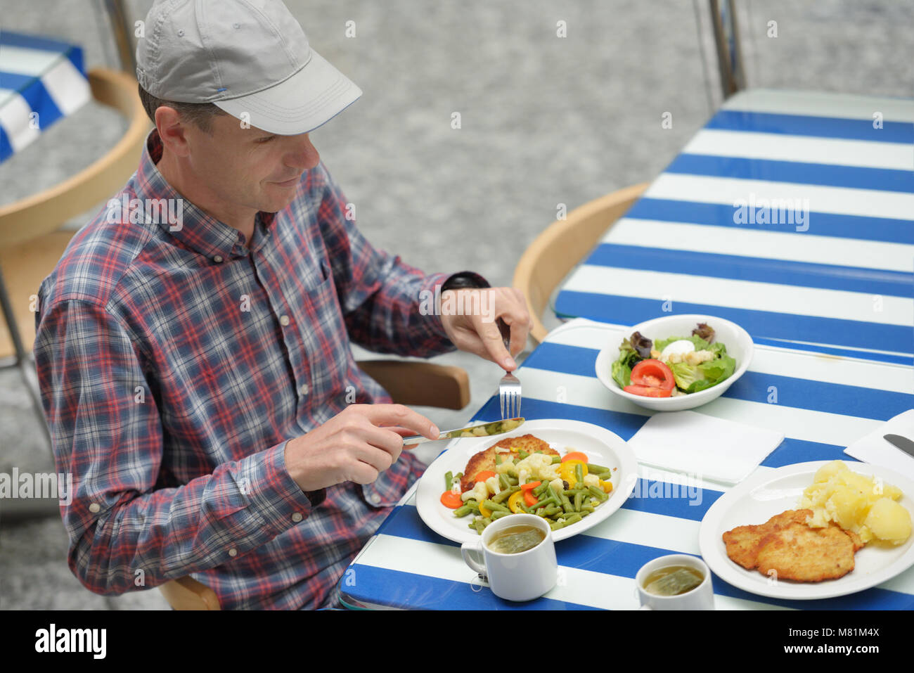 Man eating his lunch in a restaurant Stock Photo - Alamy