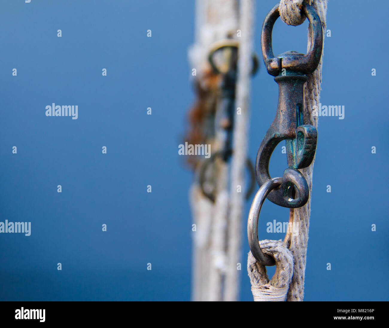 hook hanging on flag rope onboard warship Stock Photo - Alamy