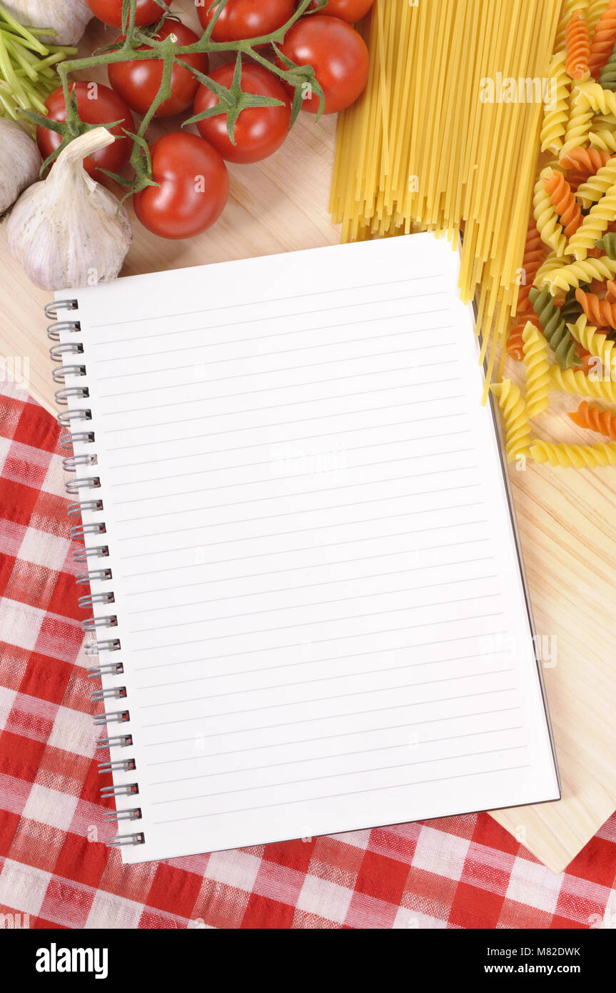Selection of Italian spaghetti and pasta with blank recipe book or ...