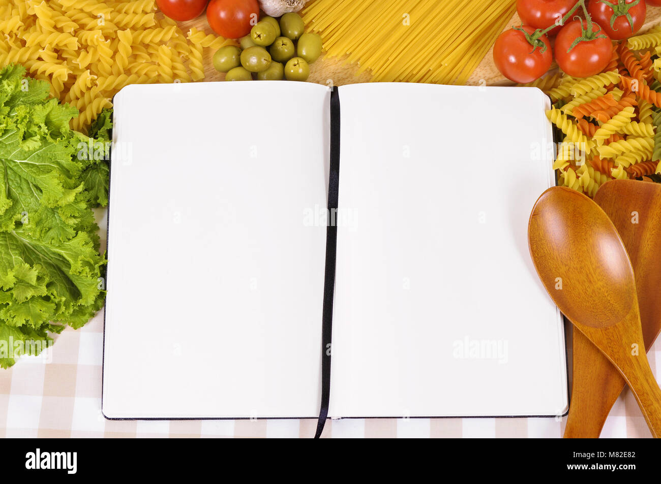 Selection of Italian spaghetti and pasta with blank recipe book or ...