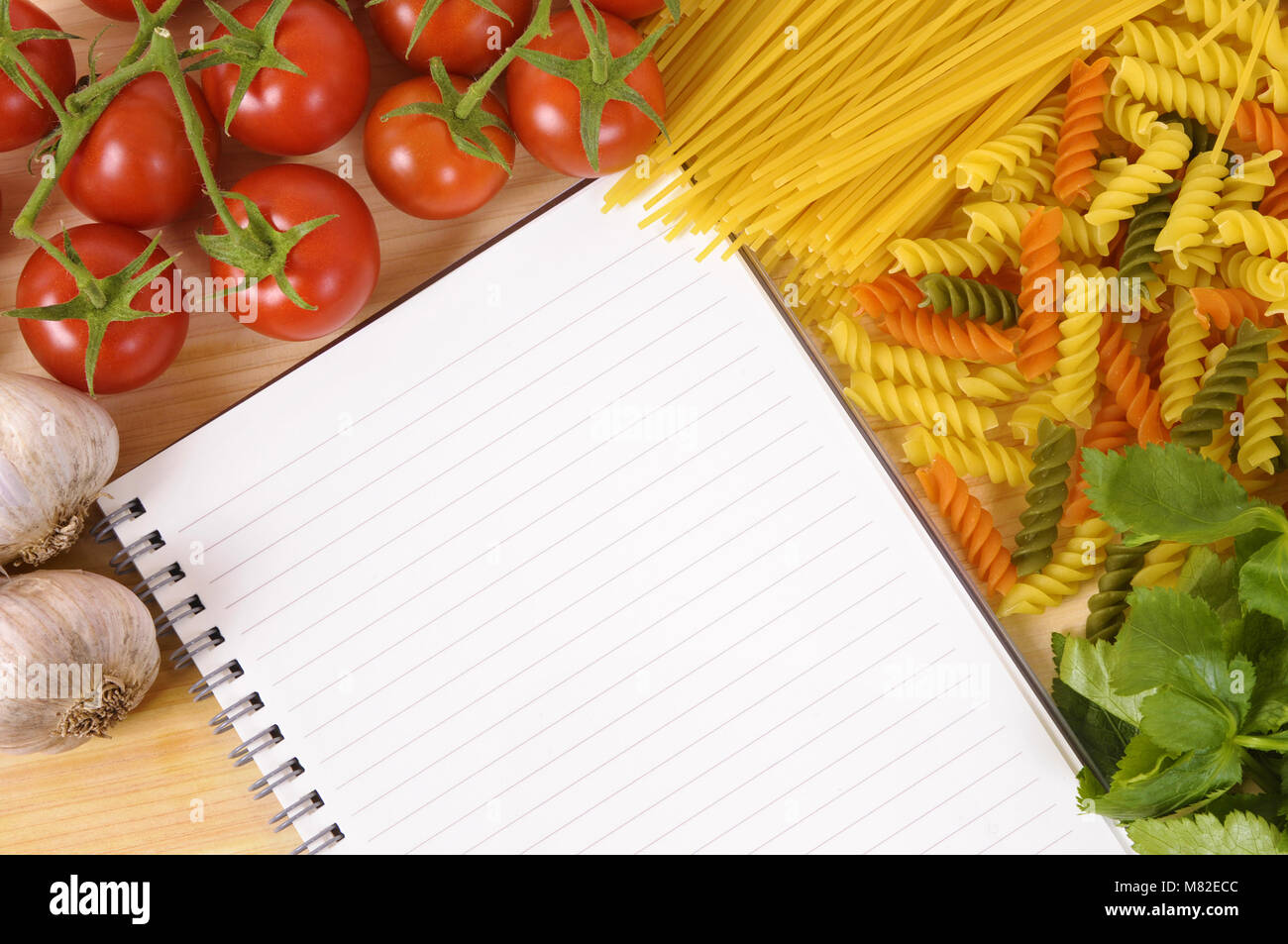 Selection of Italian spaghetti and pasta with blank recipe book or ...