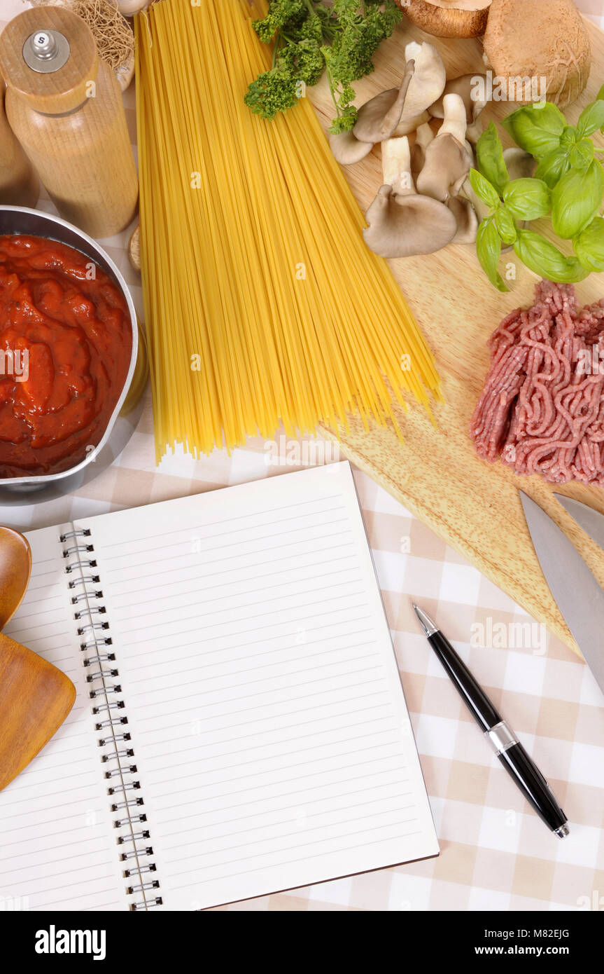 Making Italian spaghetti bolognese with ingredients and blank recipe ...