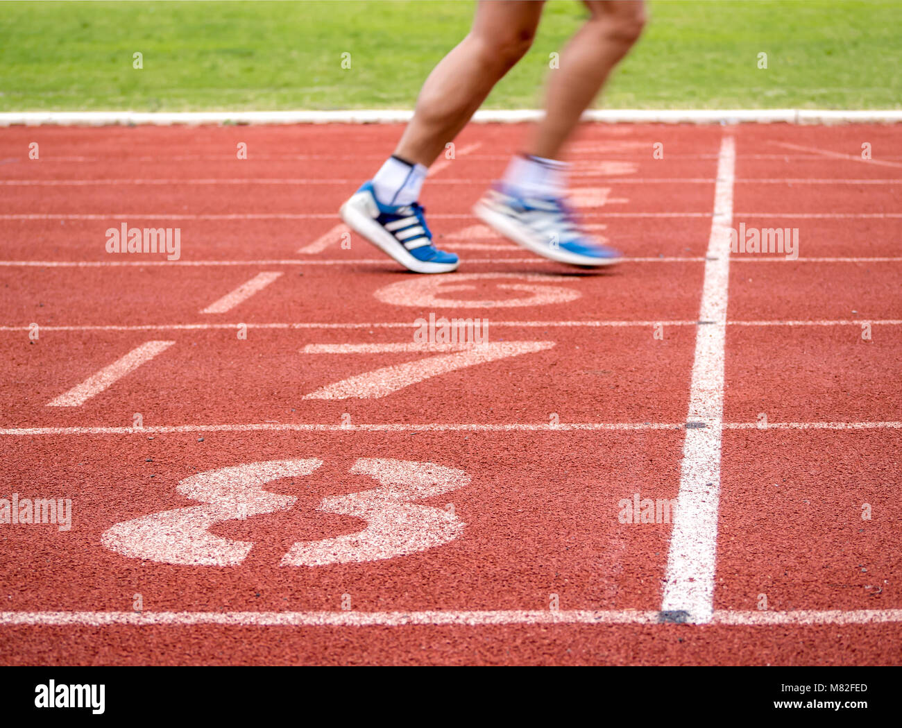 The Man Running on The Running Track Stock Photo - Alamy