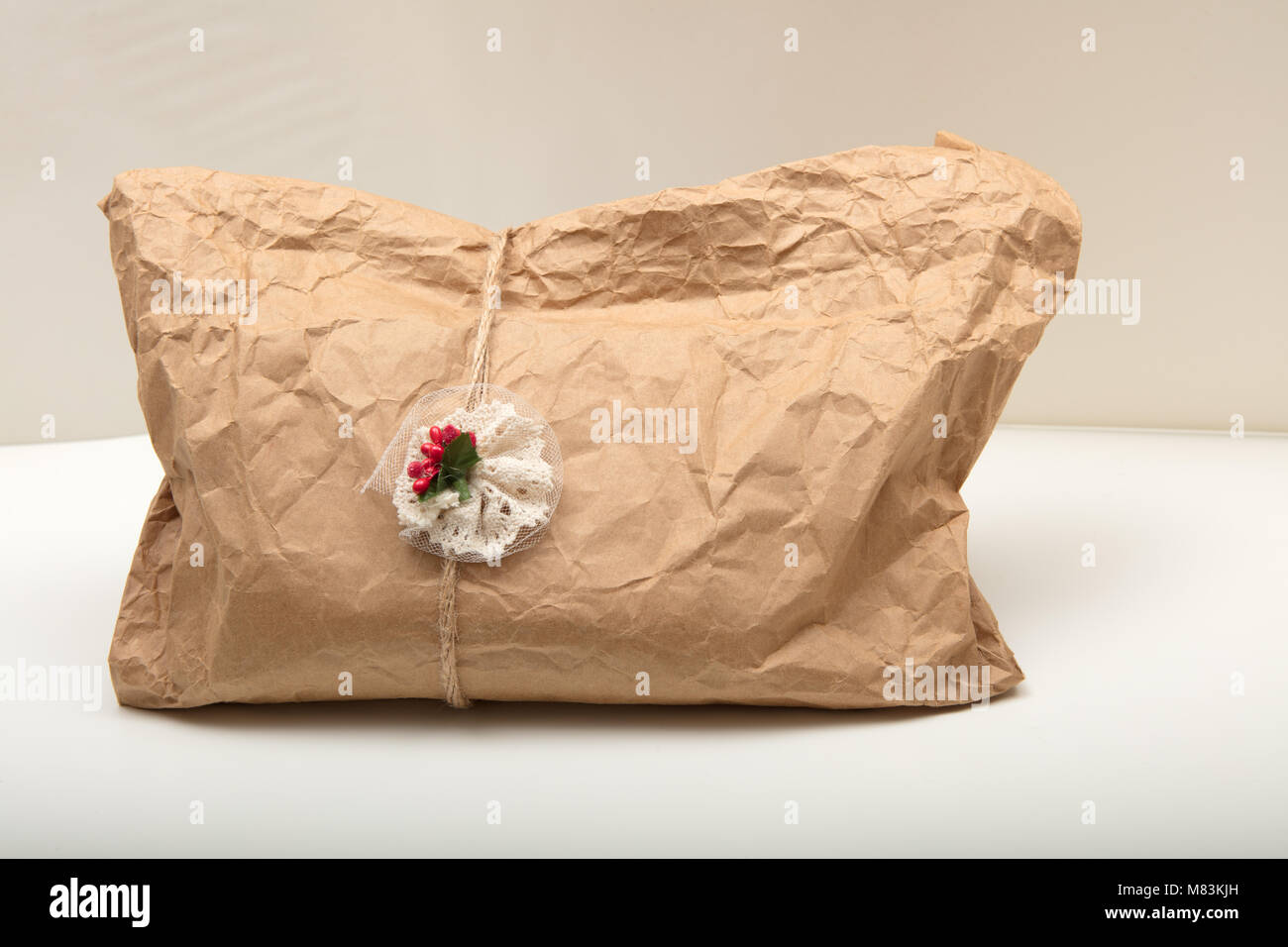 Gift in crumpled vintage recycle brown paper tied with string and ...