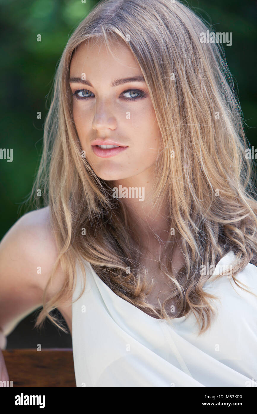 Portrait of a young model looking at the camera Stock Photo - Alamy