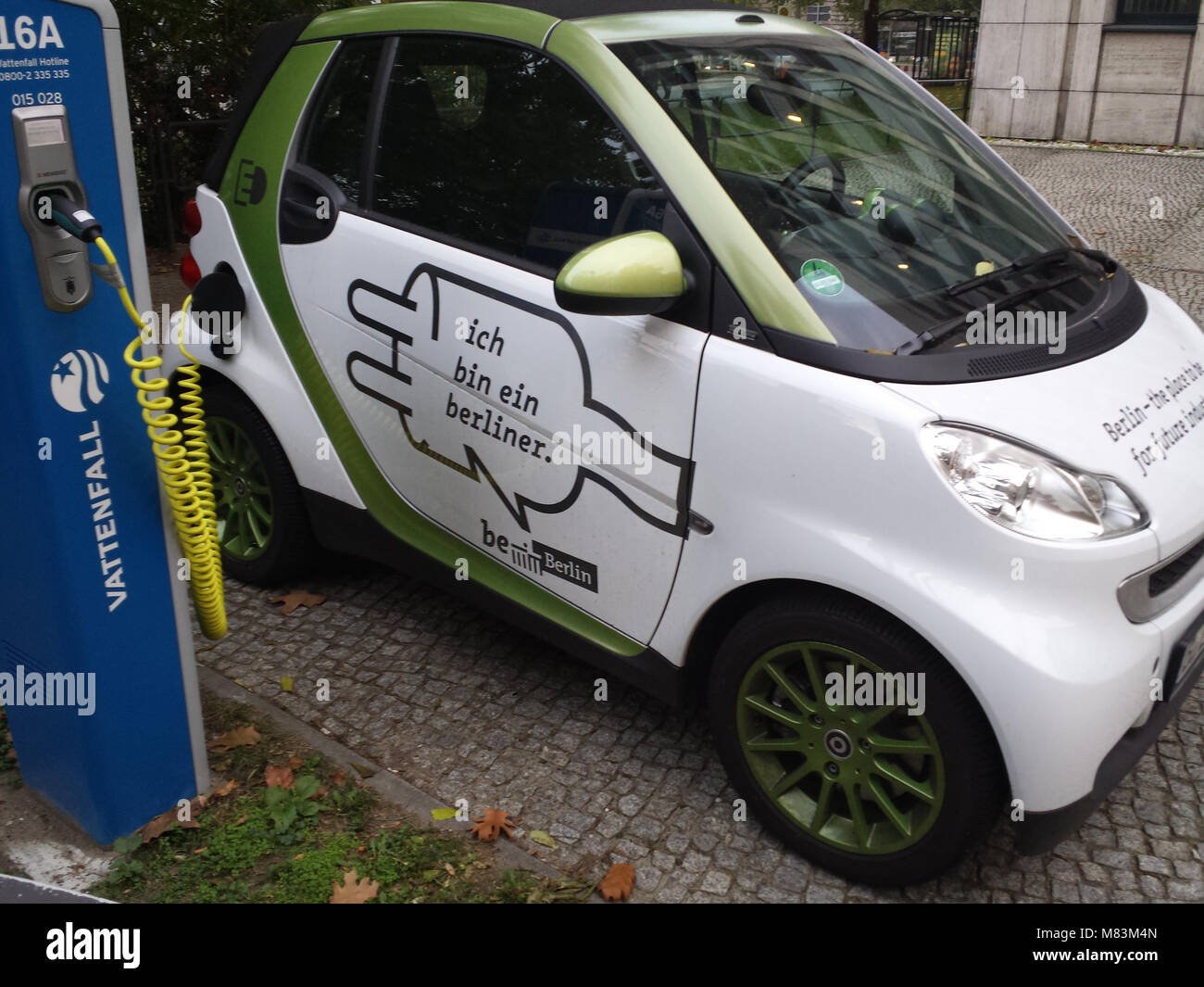 Electric car connected to charging station, Berlin, Germany Stock Photo ...