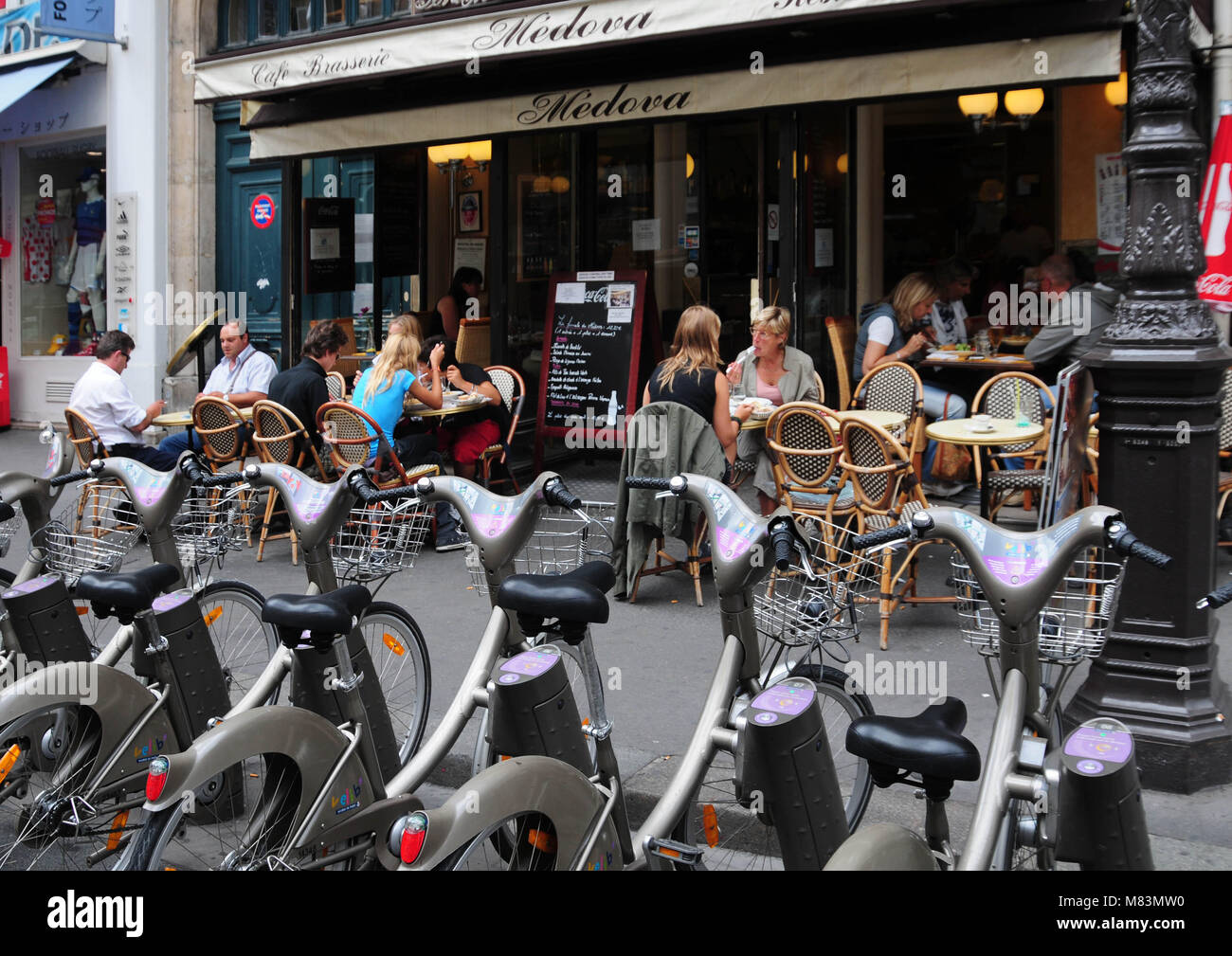 Cafe patio with customers, Paris, France Stock Photo - Alamy