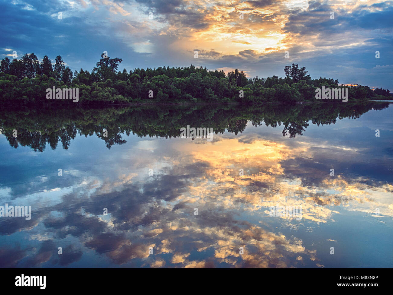 sunset, reflection in the river Stock Photo - Alamy