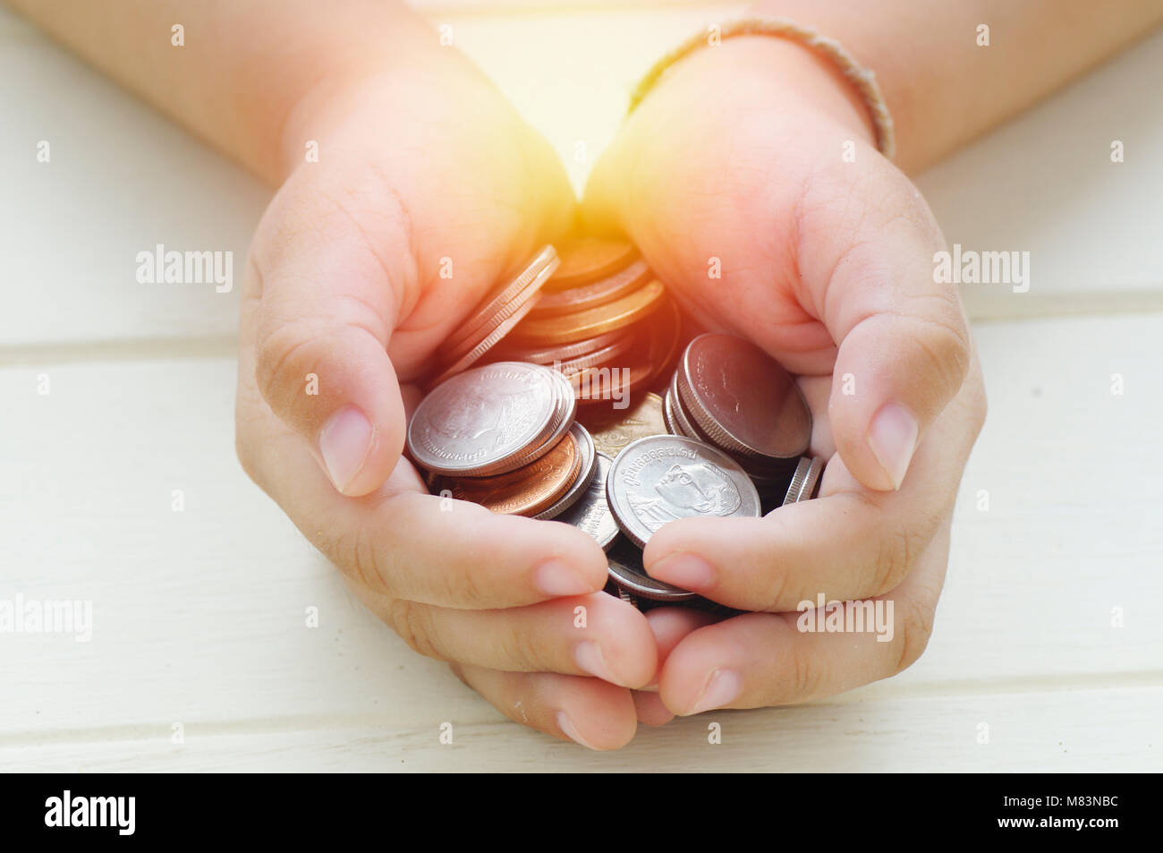 Handful of coins hi-res stock photography and images - Alamy