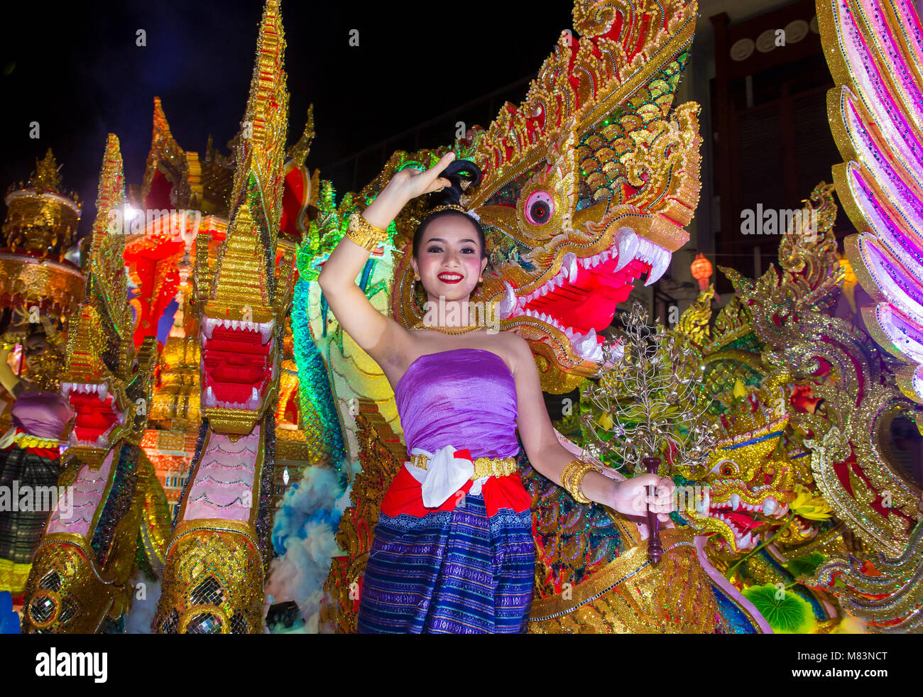 Participants in a parade during Yee Peng festival in Chiang Mai ...