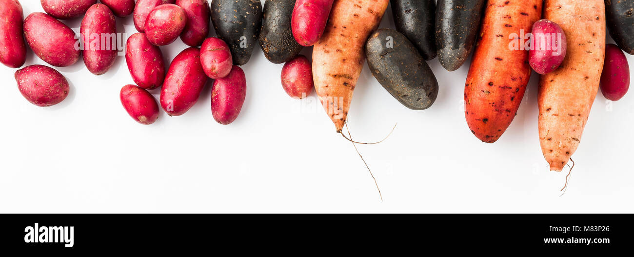 Different varieties in form and color of potatoes on a white isolated ...