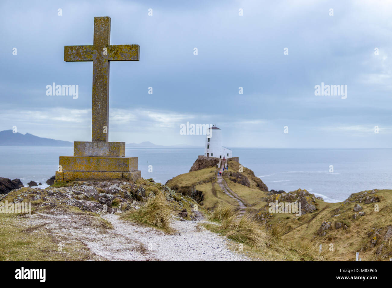 Cross and lighthouse llanddwyn island newborough hi-res stock ...