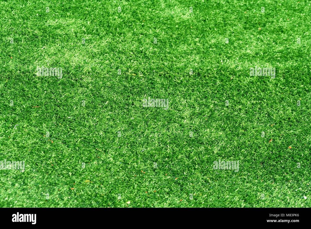 A green Astro turf background Stock Photo - Alamy