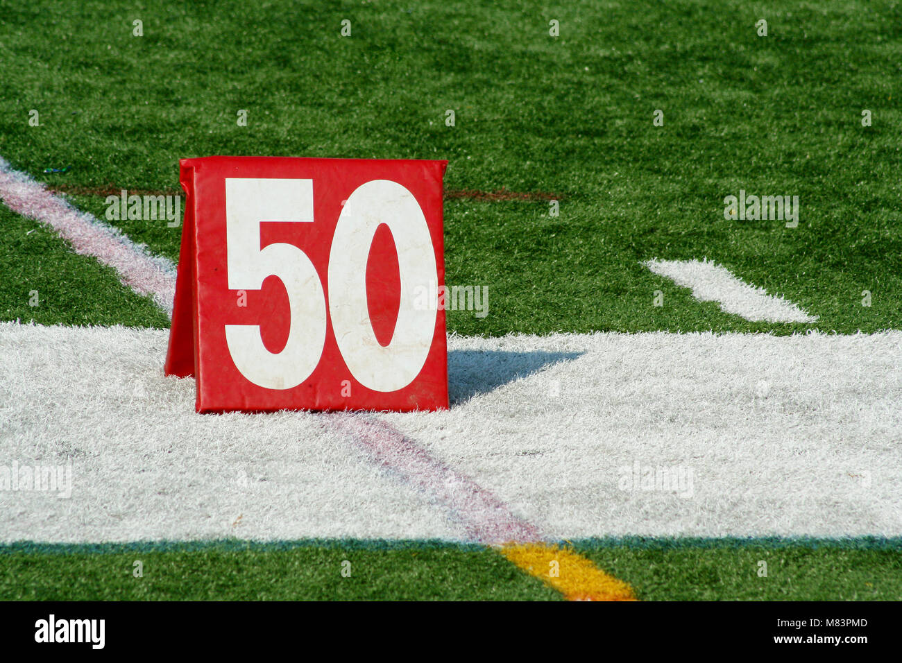 A red Football fifty yard marker Stock Photo - Alamy