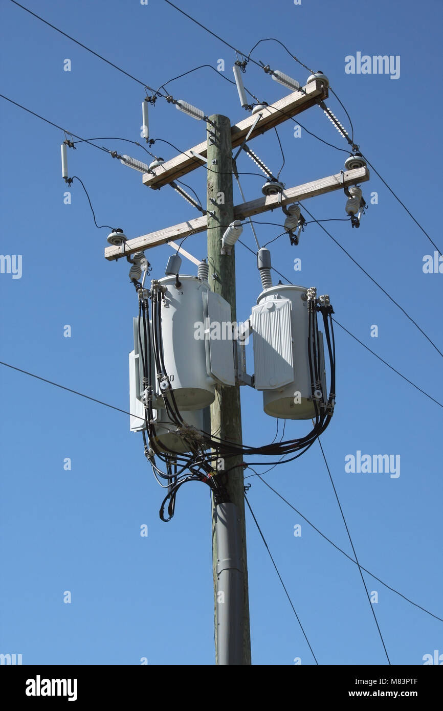 A Telephone pole with three transformers Stock Photo - Alamy