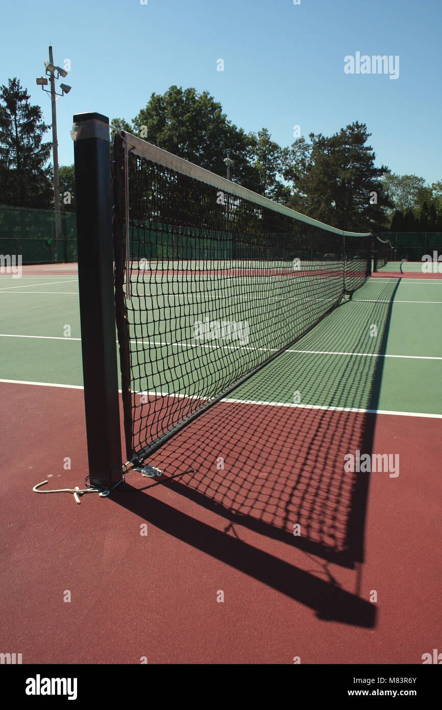 A empty green Tennis Court with net Stock Photo - Alamy