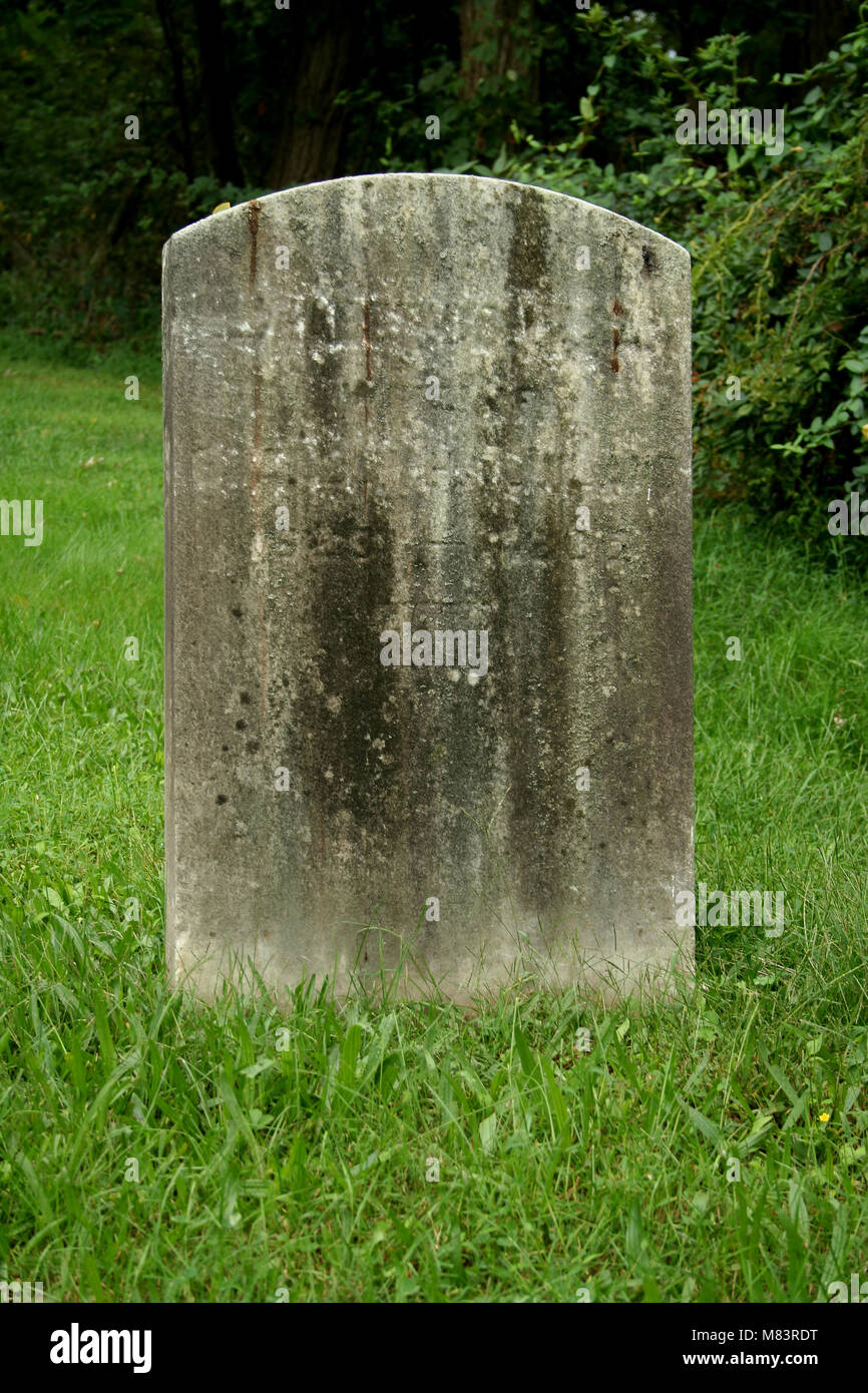 Old Gravestone with grass in a graveyard Stock Photo - Alamy
