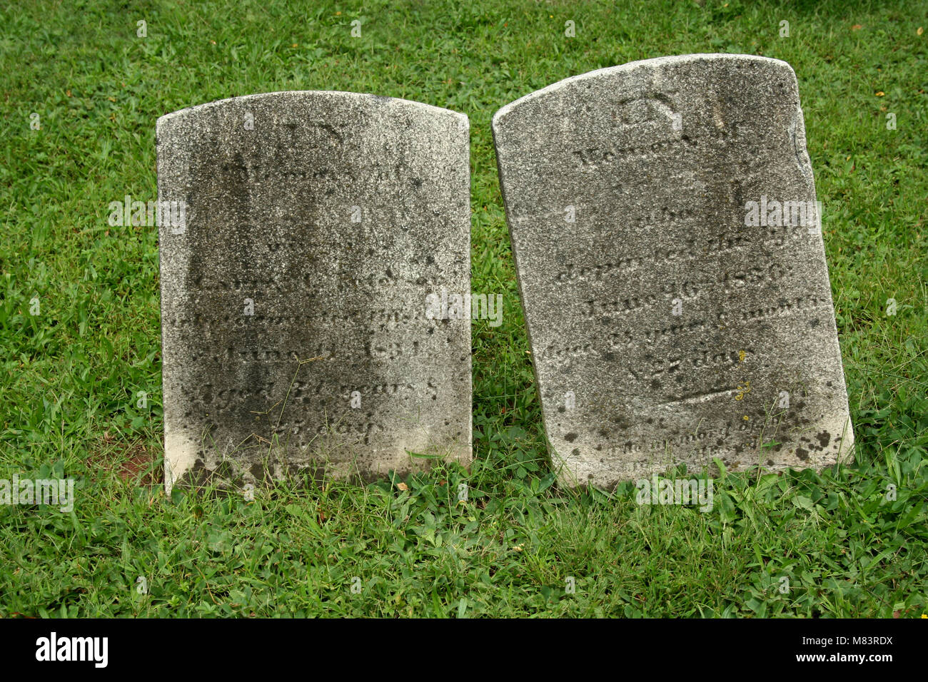 Two Old Gravestone with grass in a graveyard Stock Photo - Alamy