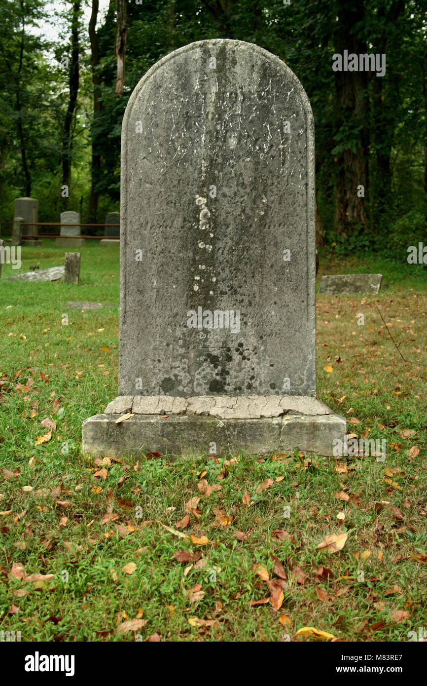 Old Gravestone with grass in a graveyard Stock Photo - Alamy