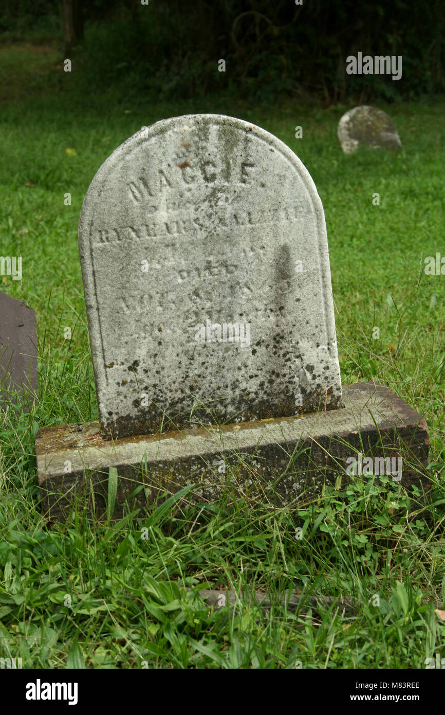 Old Gravestone with grass in a graveyard Stock Photo - Alamy