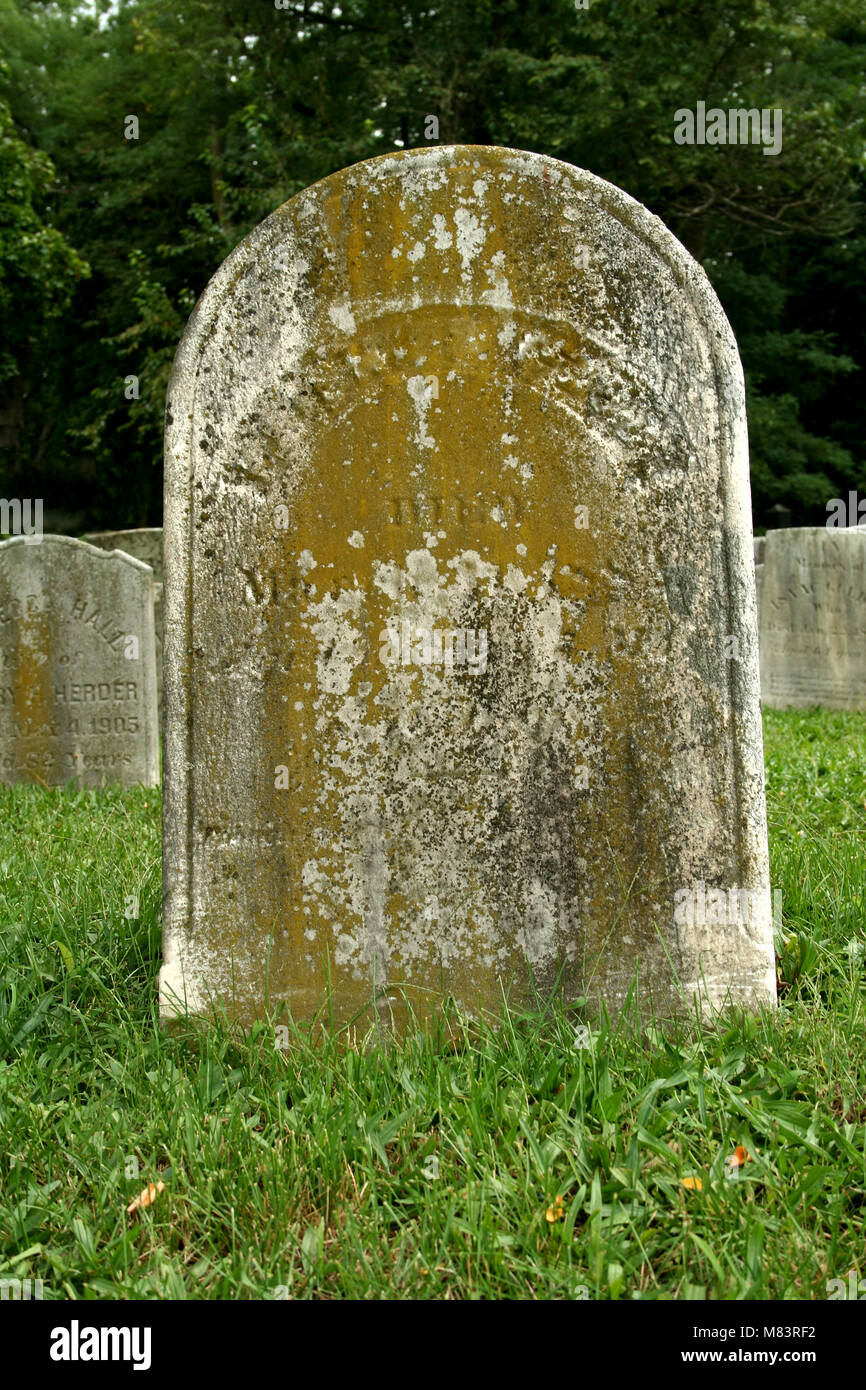 Old Gravestone with grass in a graveyard Stock Photo - Alamy