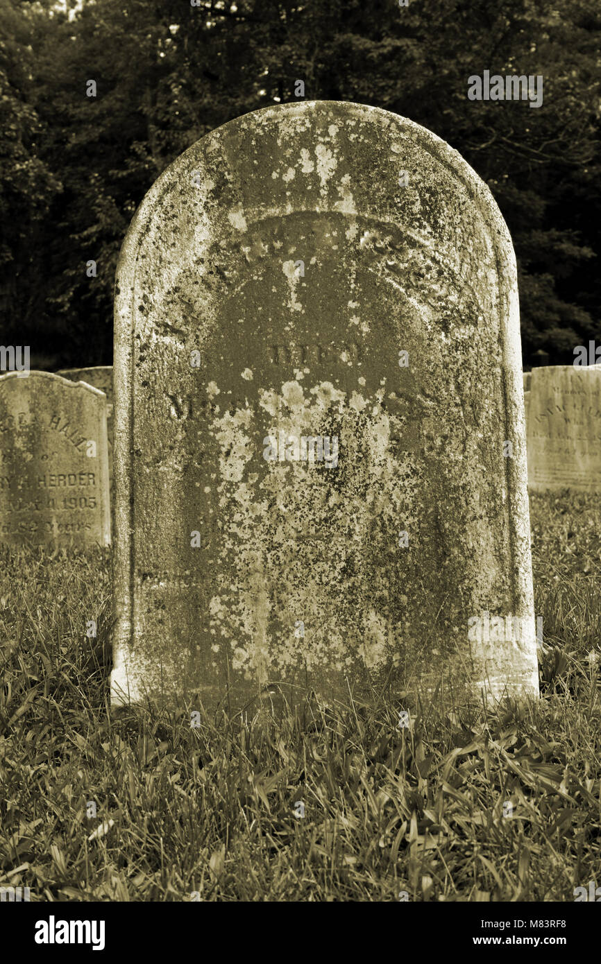 Old Gravestone with grass in a graveyard Stock Photo - Alamy