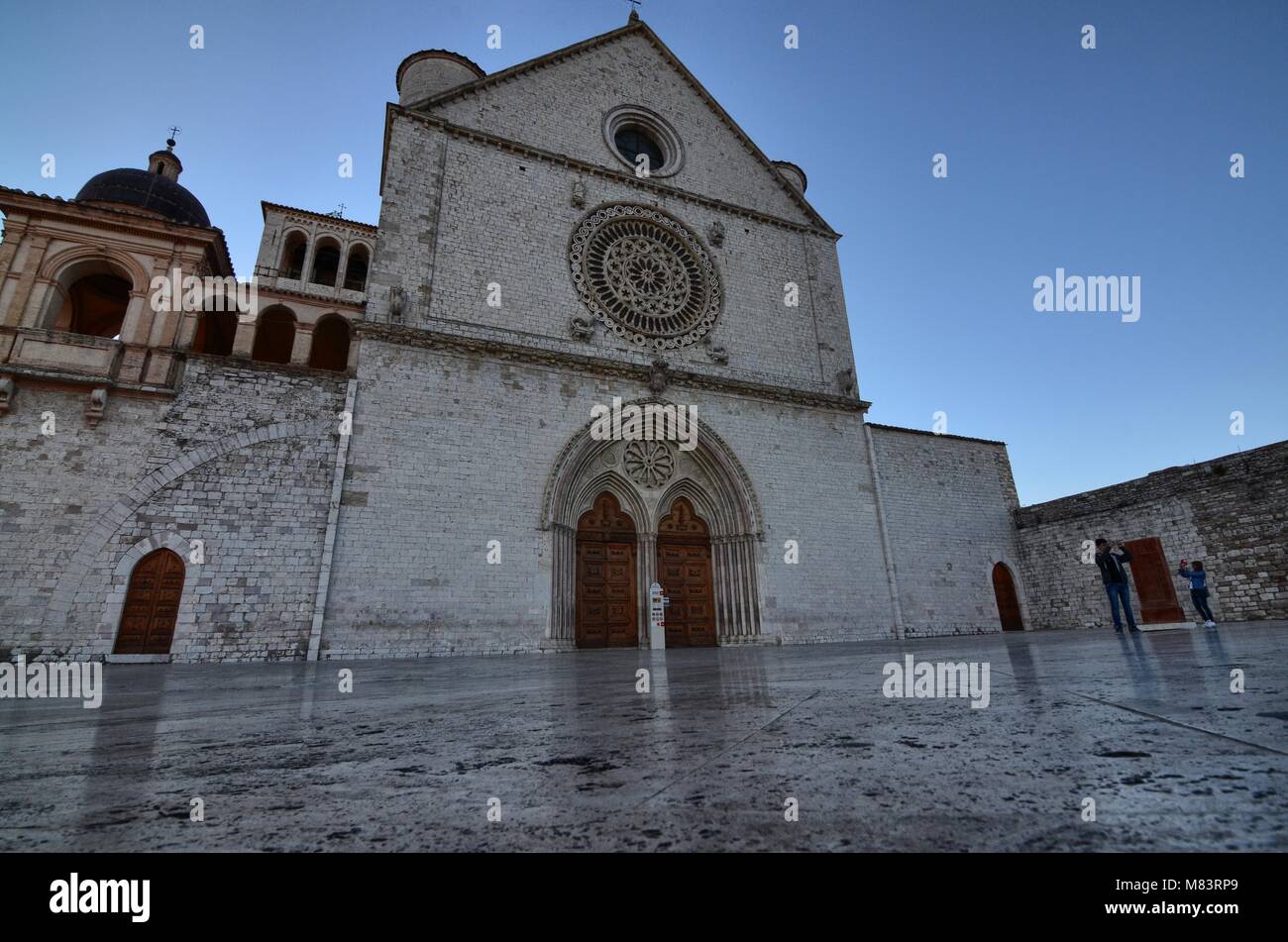 Front view of the Basilica of Saint Francis of Assisi. The churchyard ...
