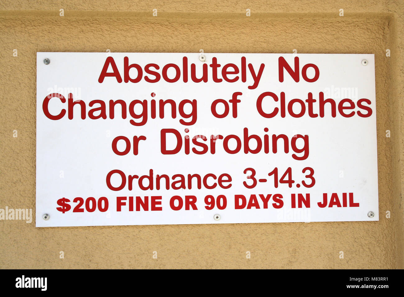 A No Changing Clothes Sign at the beach Stock Photo - Alamy