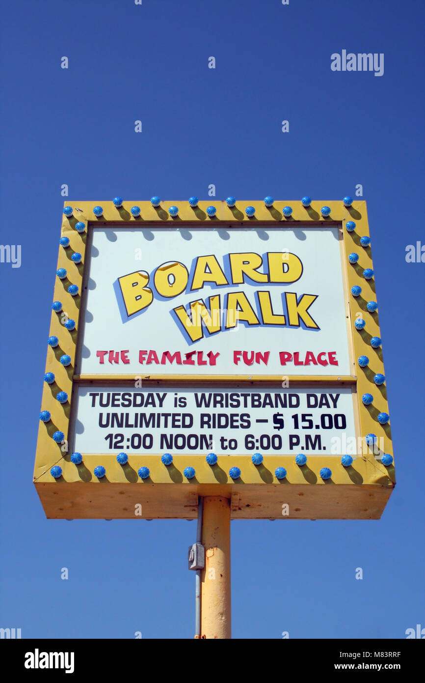 A Lighted Boardwalk sign against a blue sky Stock Photo - Alamy