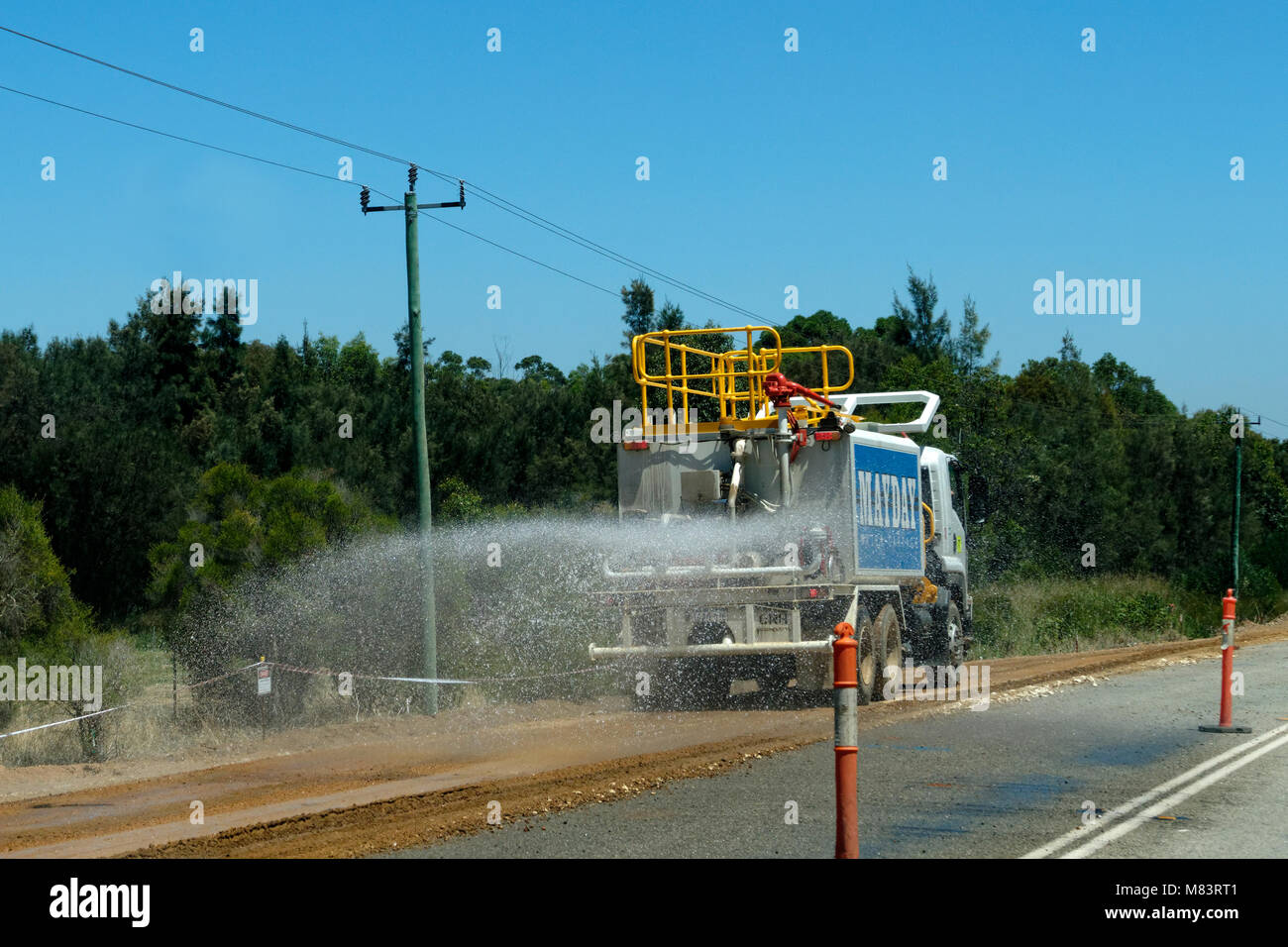 Water truck spraying water on road works, Perth, Western Australia ...