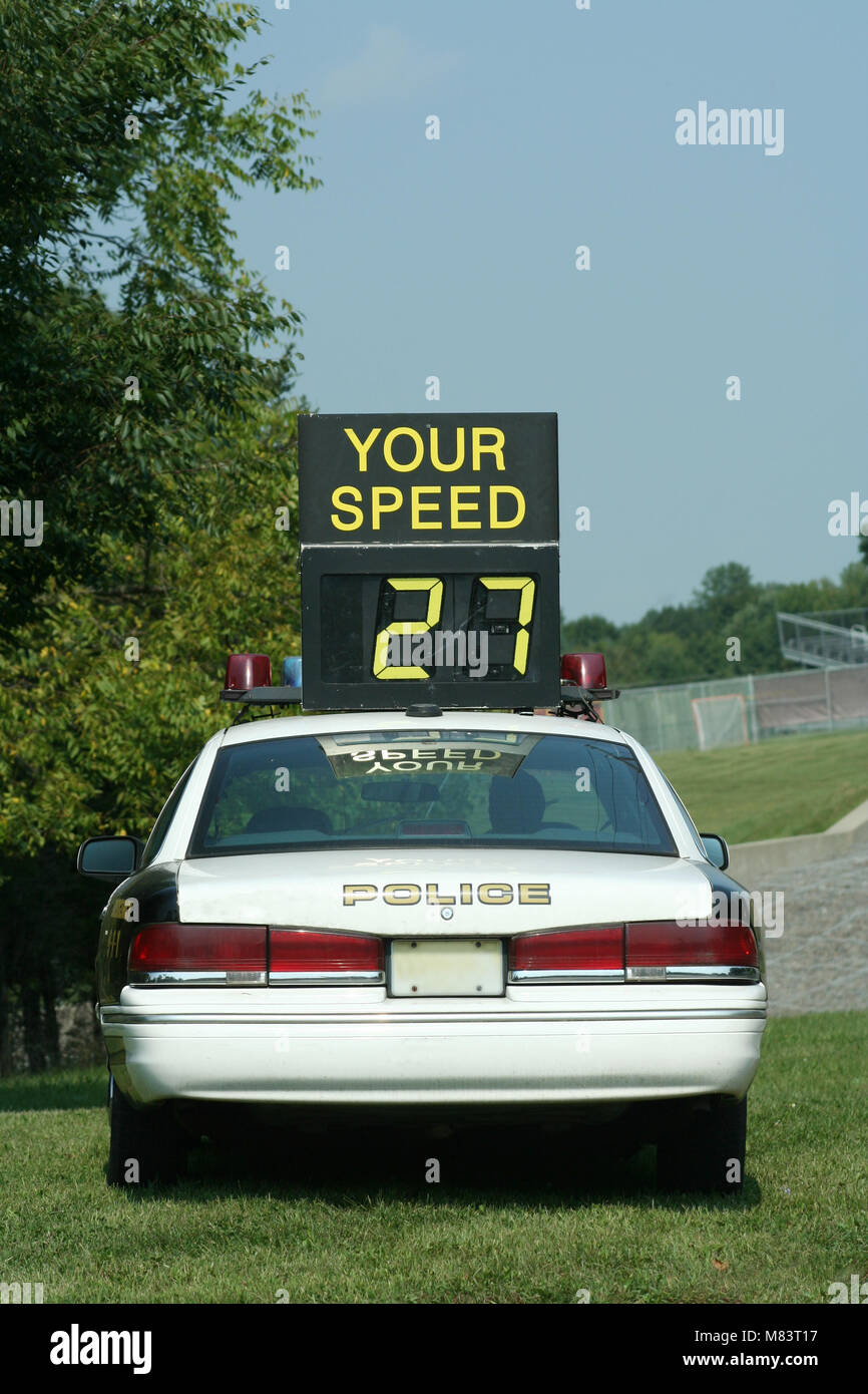 A Police Car Speed Check against blue sky Stock Photo - Alamy