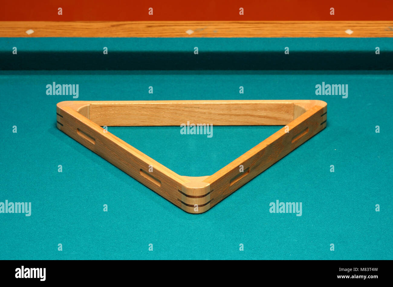 Empty 8 ball rack on a pool table Stock Photo - Alamy