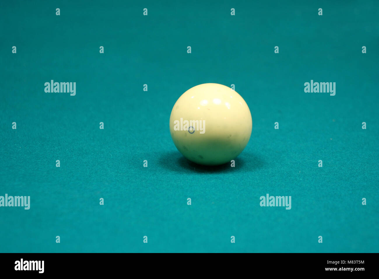 Cue ball on a green table Stock Photo - Alamy