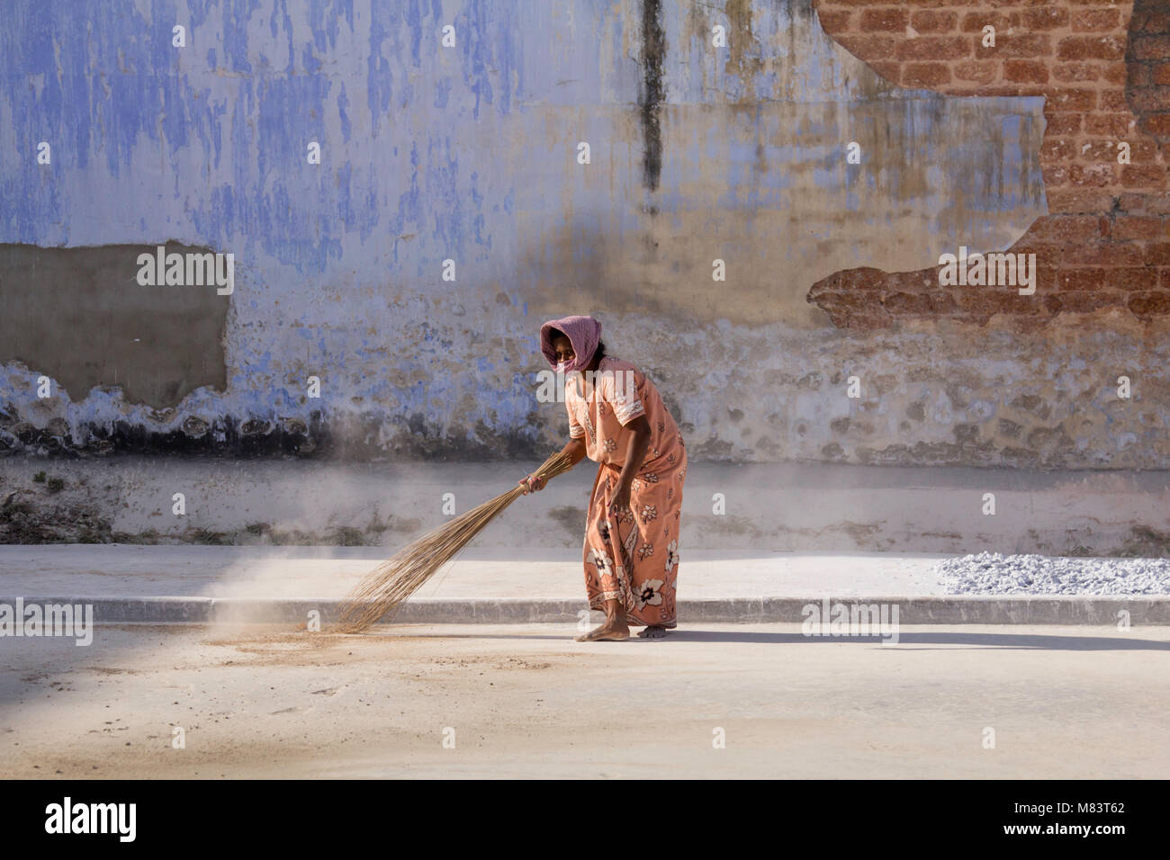 A Woman Sweeping Street Stock Photos & A Woman Sweeping Street Stock ...