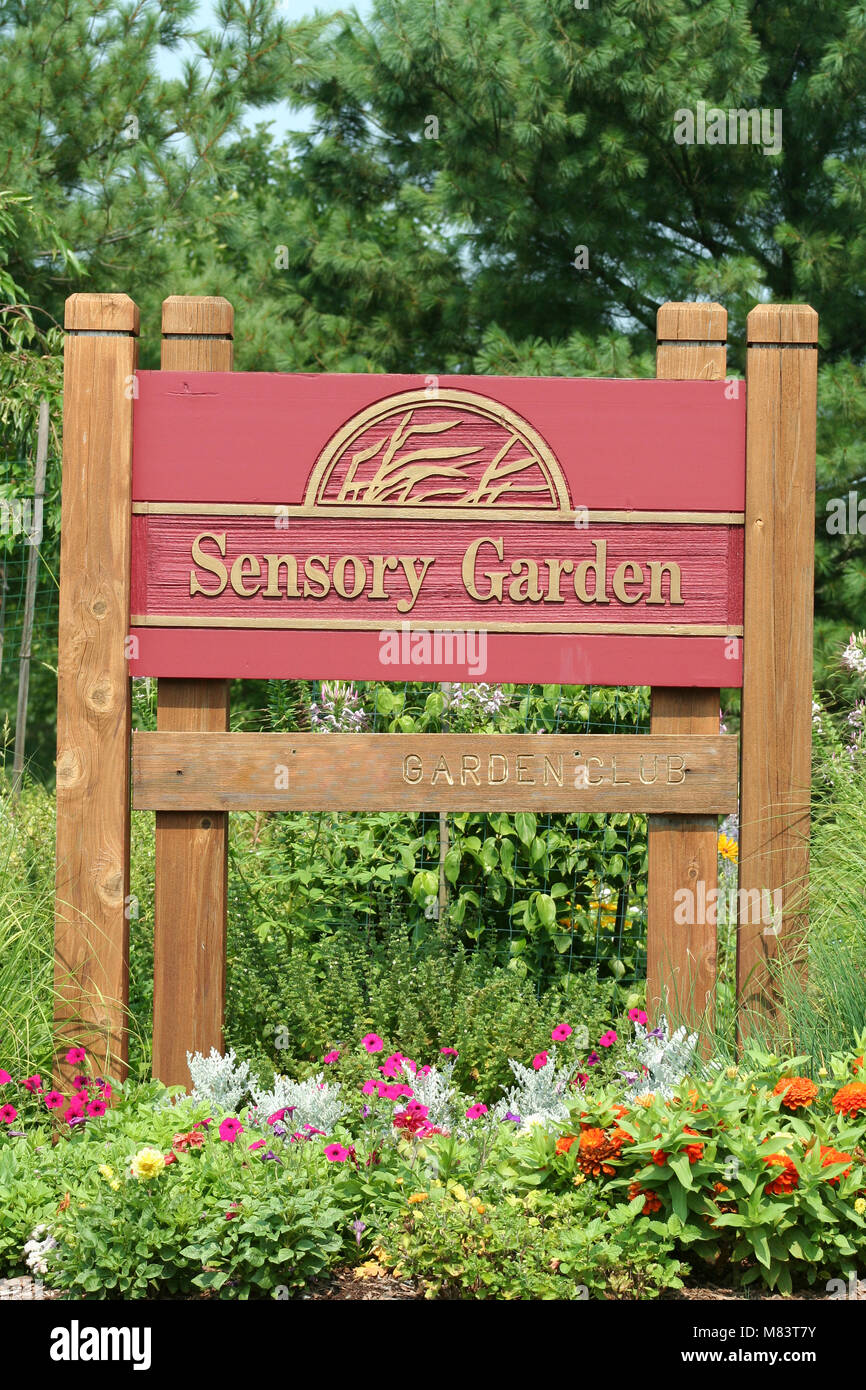 An image of a garden sign with flowers Stock Photo - Alamy