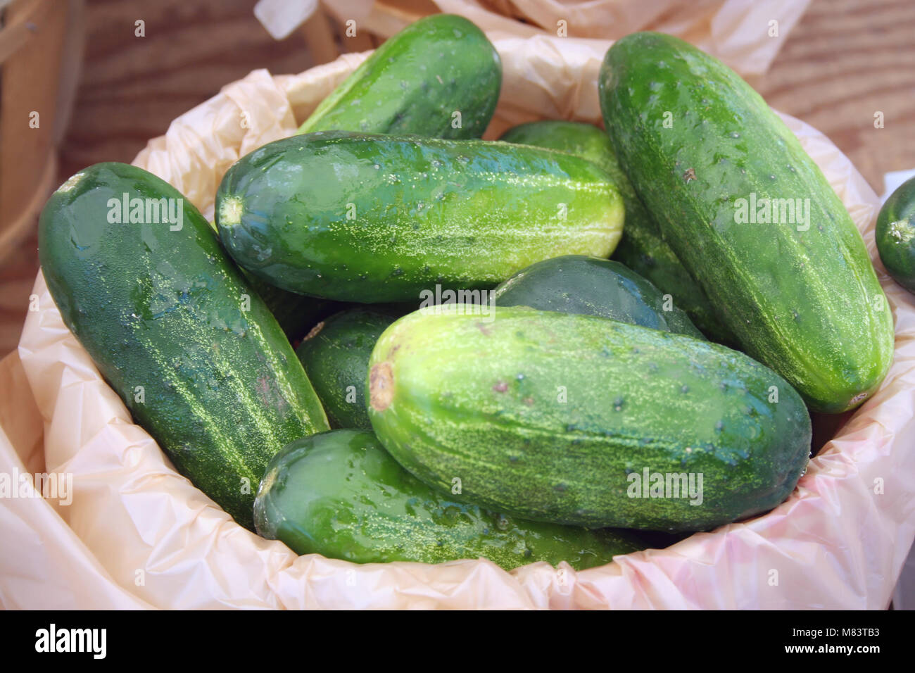 a bunch of Cucumbers for sale at the market Stock Photo - Alamy