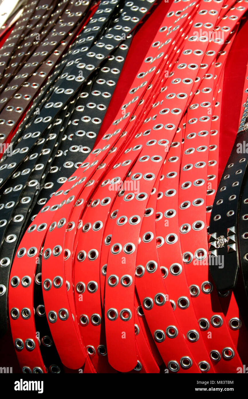 a bunch of belts at a flea market Stock Photo - Alamy