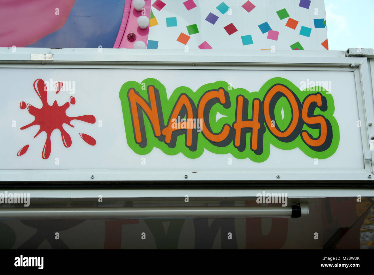 Nachos Sign on carnival refreshment stand Stock Photo - Alamy