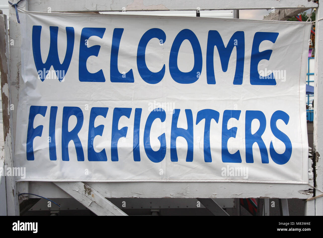 Bule and white Welcome firefighters sign Stock Photo - Alamy