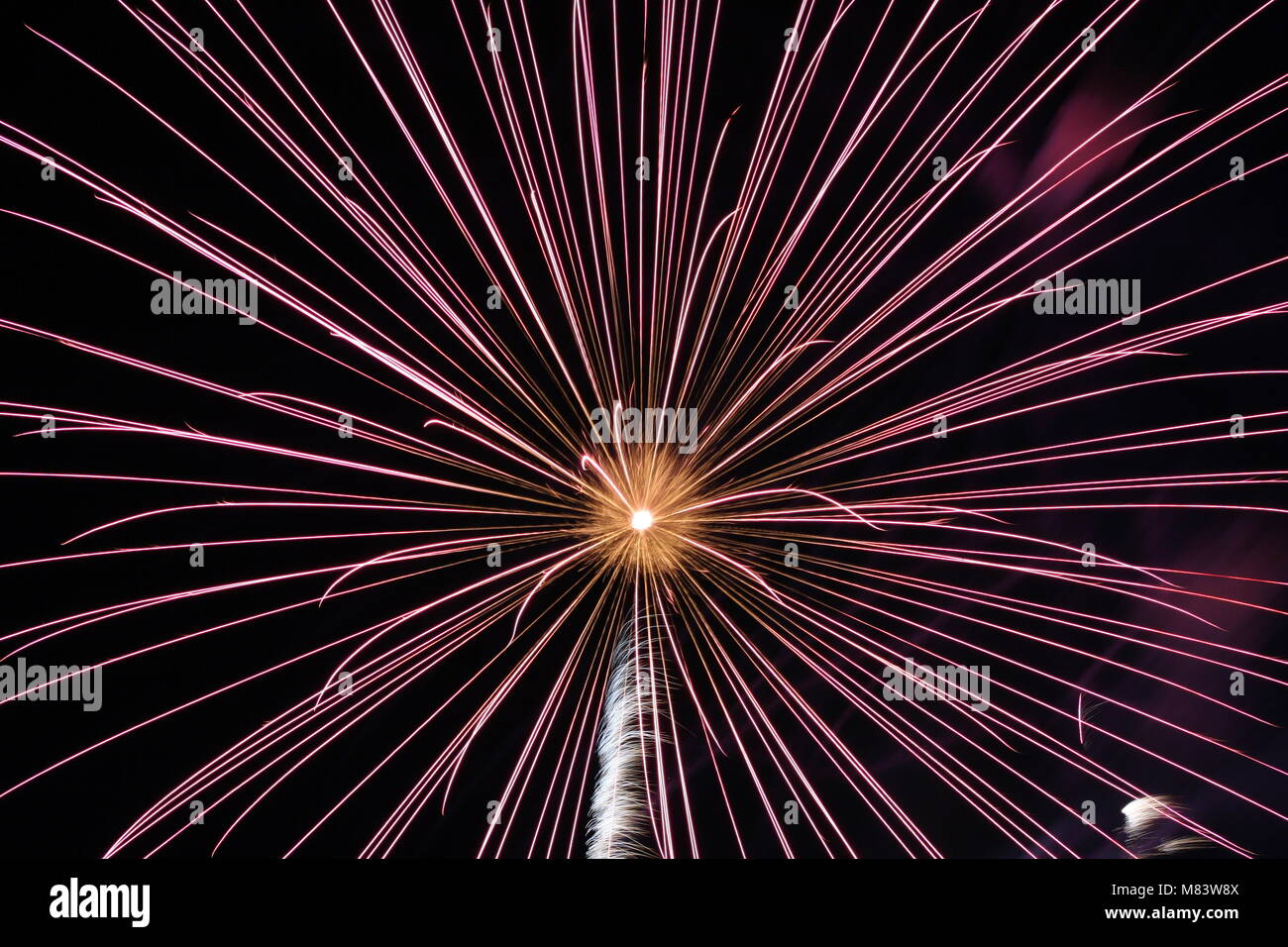 an image of exploding fireworks at night Stock Photo - Alamy