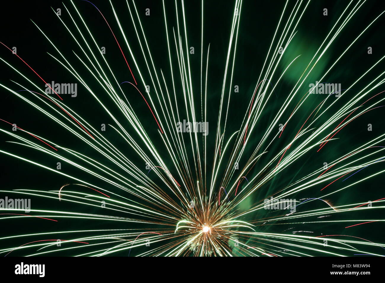 an image of exploding fireworks at night Stock Photo - Alamy