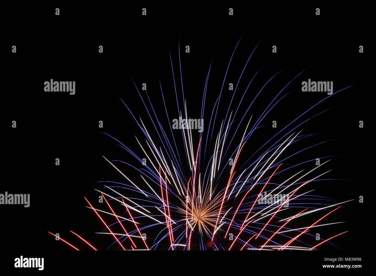 an image of exploding fireworks at night Stock Photo - Alamy