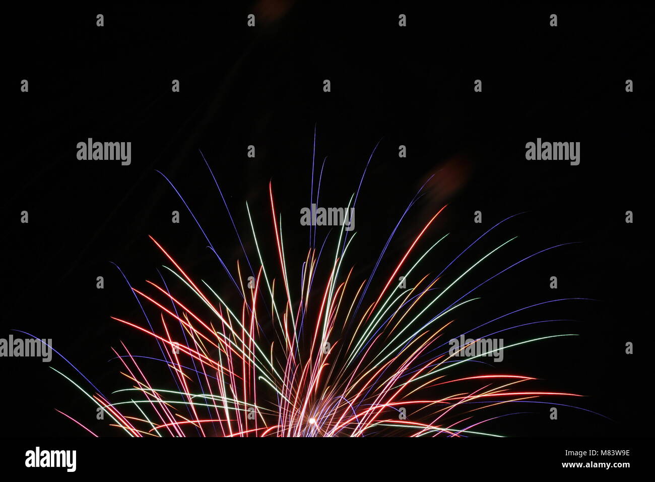 an image of exploding fireworks at night Stock Photo - Alamy