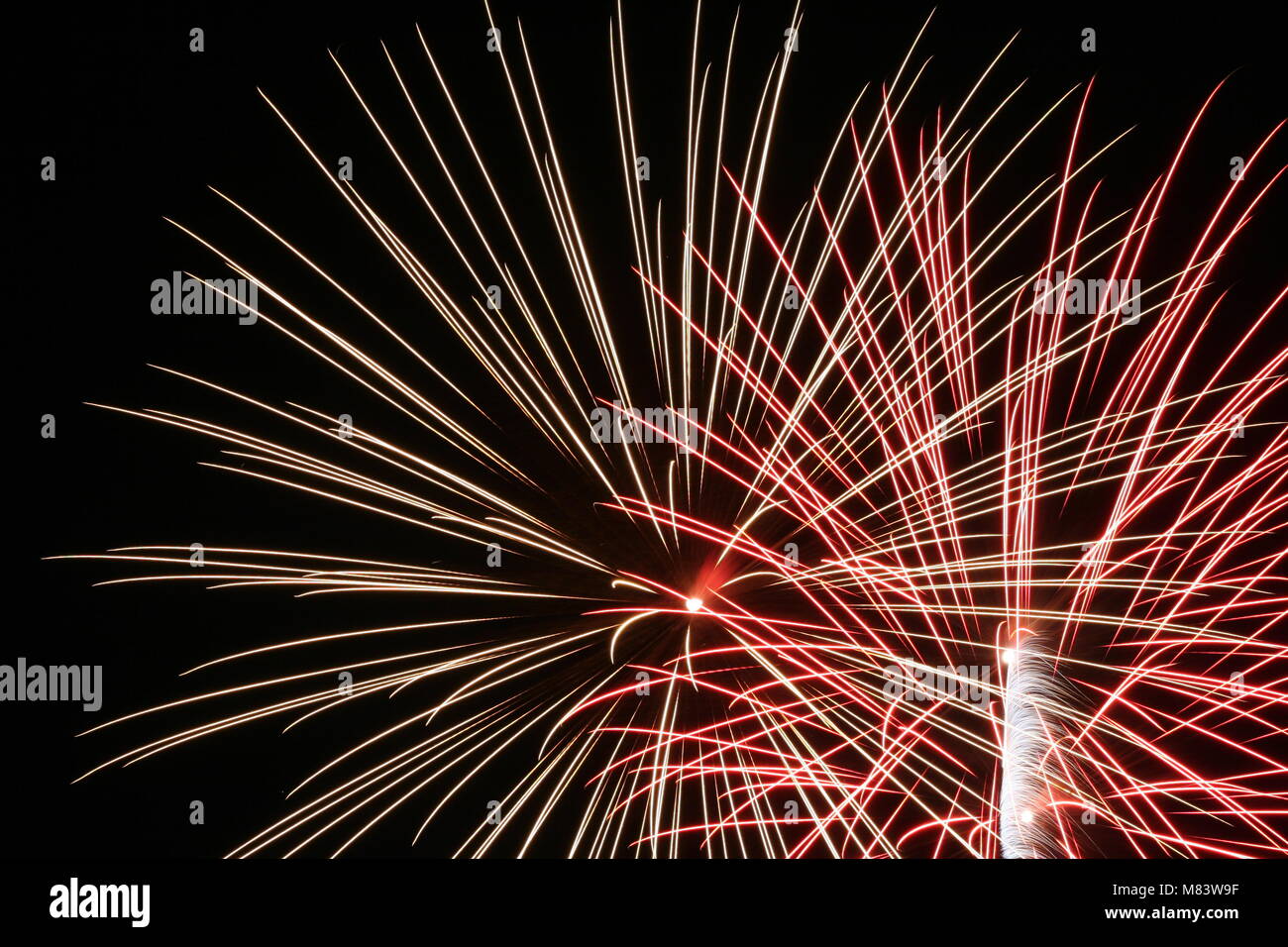 an image of exploding fireworks at night Stock Photo - Alamy