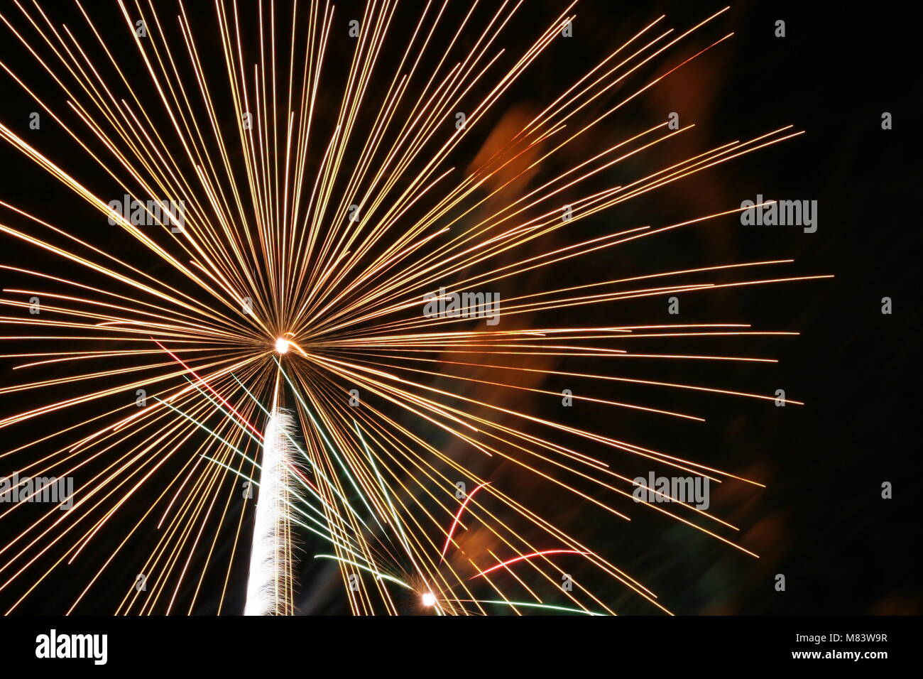 an image of exploding fireworks at night Stock Photo - Alamy