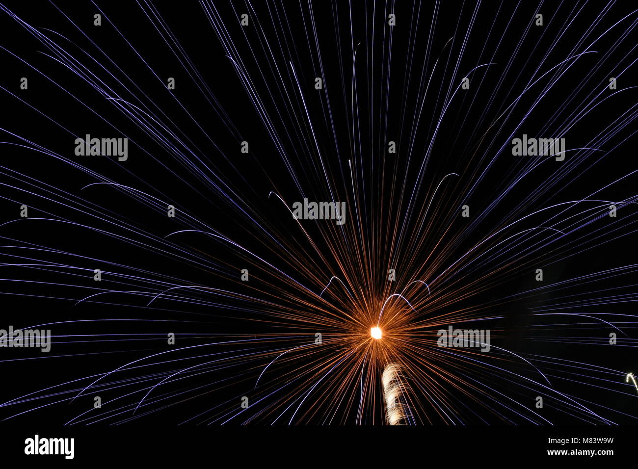 an image of exploding fireworks at night Stock Photo - Alamy