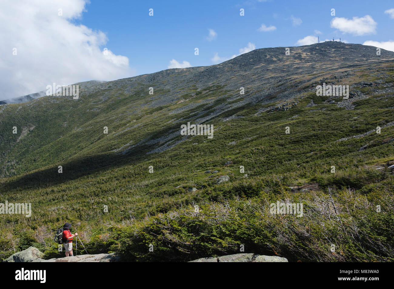 A hiker ascending the Ammonoosuc Ravine Trail in Sargent’s Purchase of ...