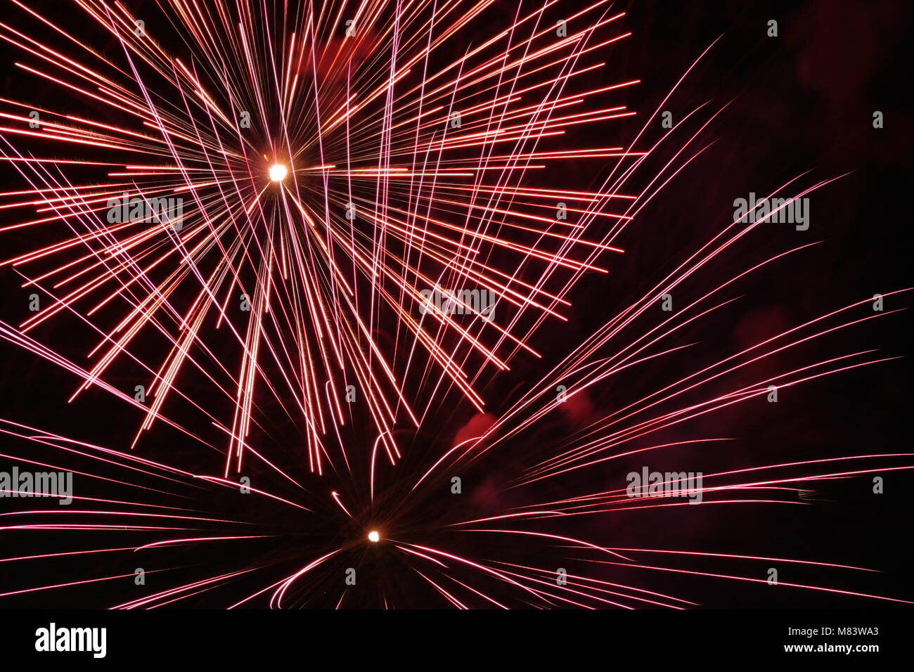 an image of exploding fireworks at night Stock Photo - Alamy