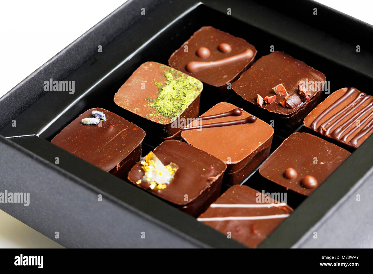 Chocolate candies in a box Stock Photo - Alamy
