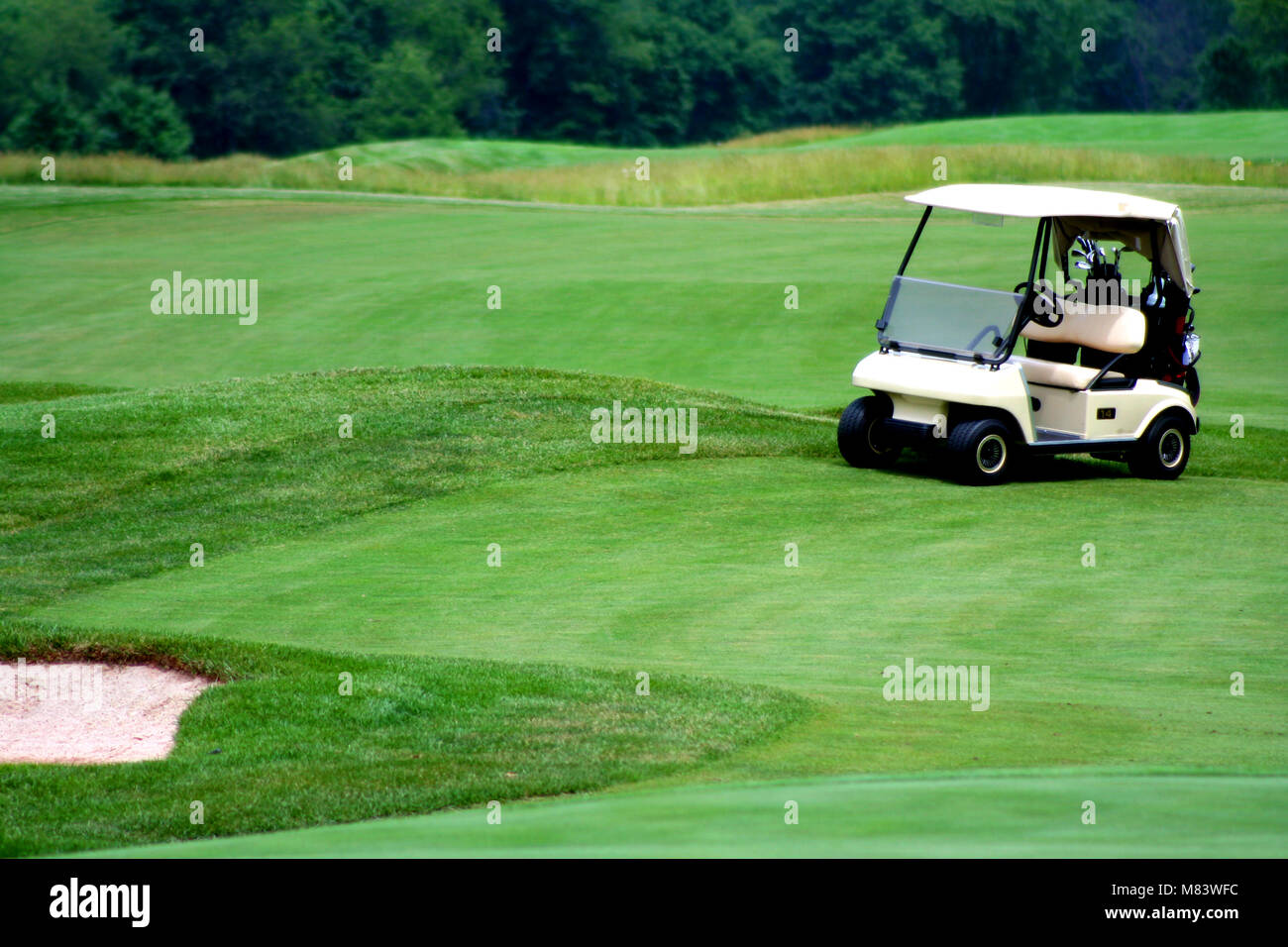 an image of a Golf cart on golf course Stock Photo - Alamy